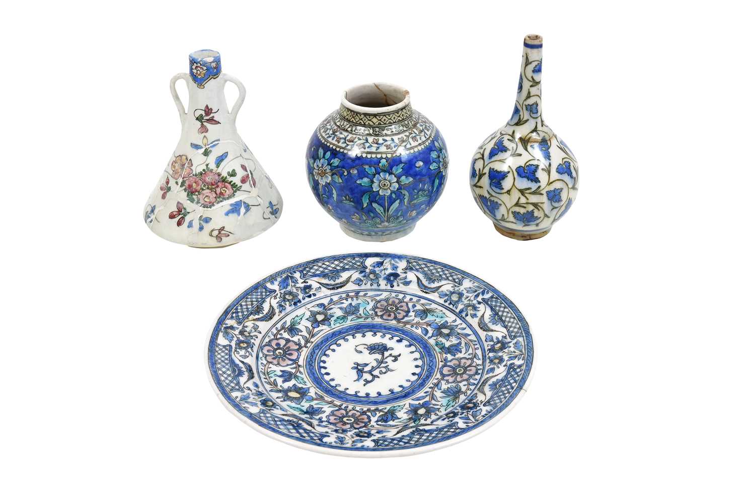 Lot 254 - FOUR POLYCHROME-PAINTED QAJAR POTTERY